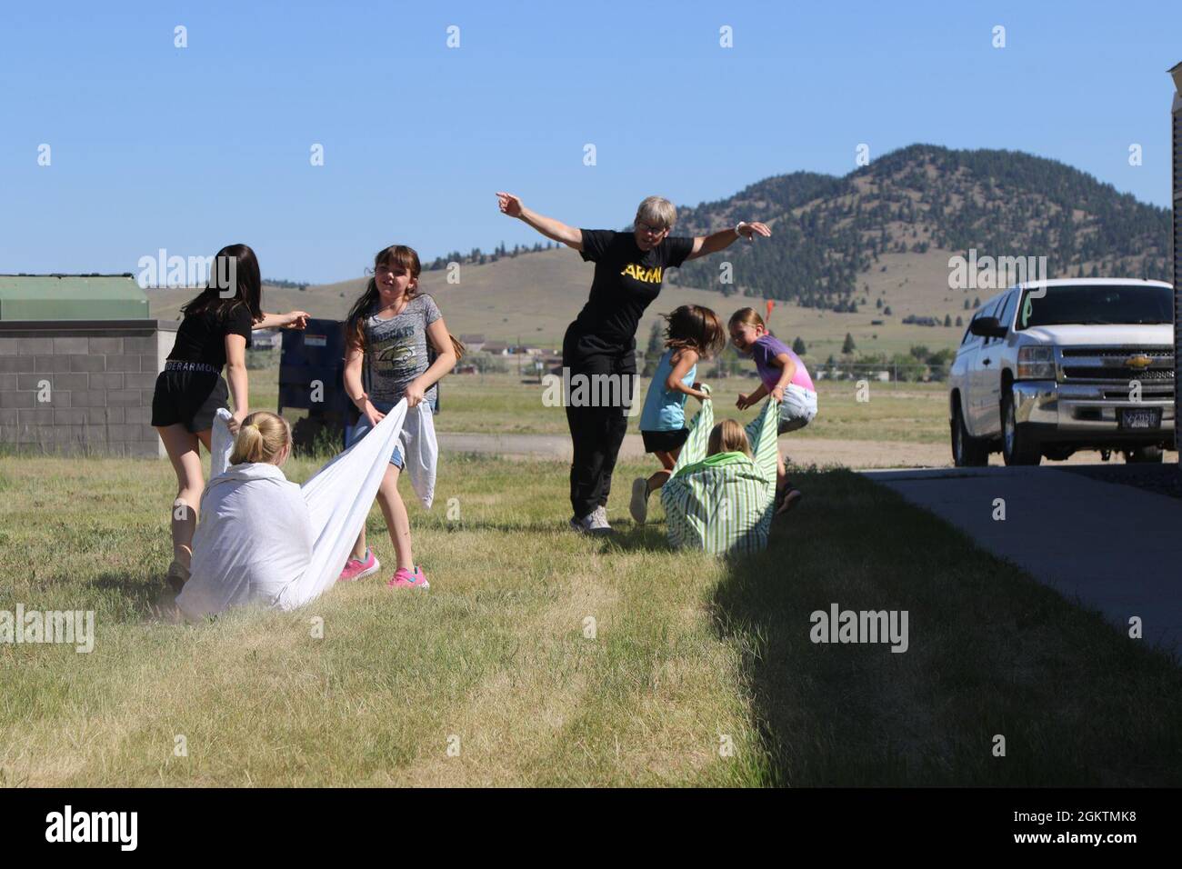 Campers compete in a modified sprint-drag-carry during the Fort ...
