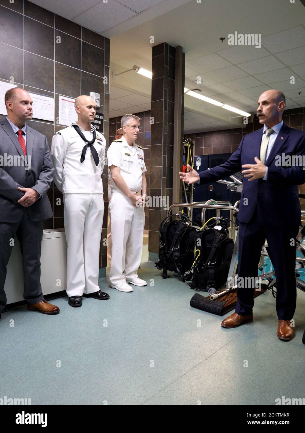 Rear Adm. Tim Weber, Commander, Naval Medical Forces Pacific, listens ...
