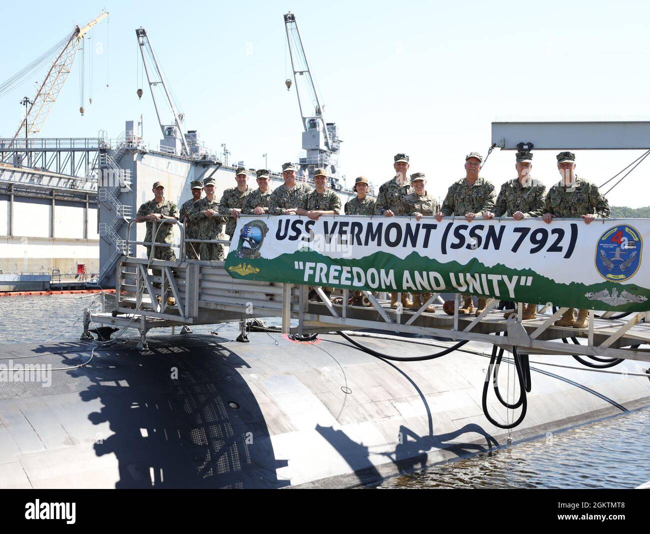 Crew members assigned to the Virginia-class fast-attack submarine USS ...