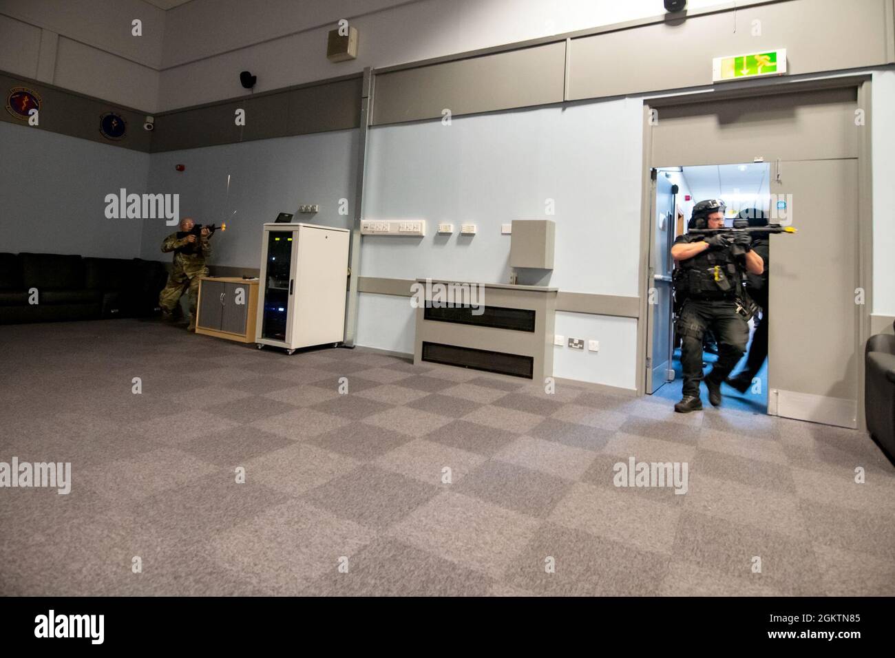 A simulated active shooter, left, engages with police officers from the ...