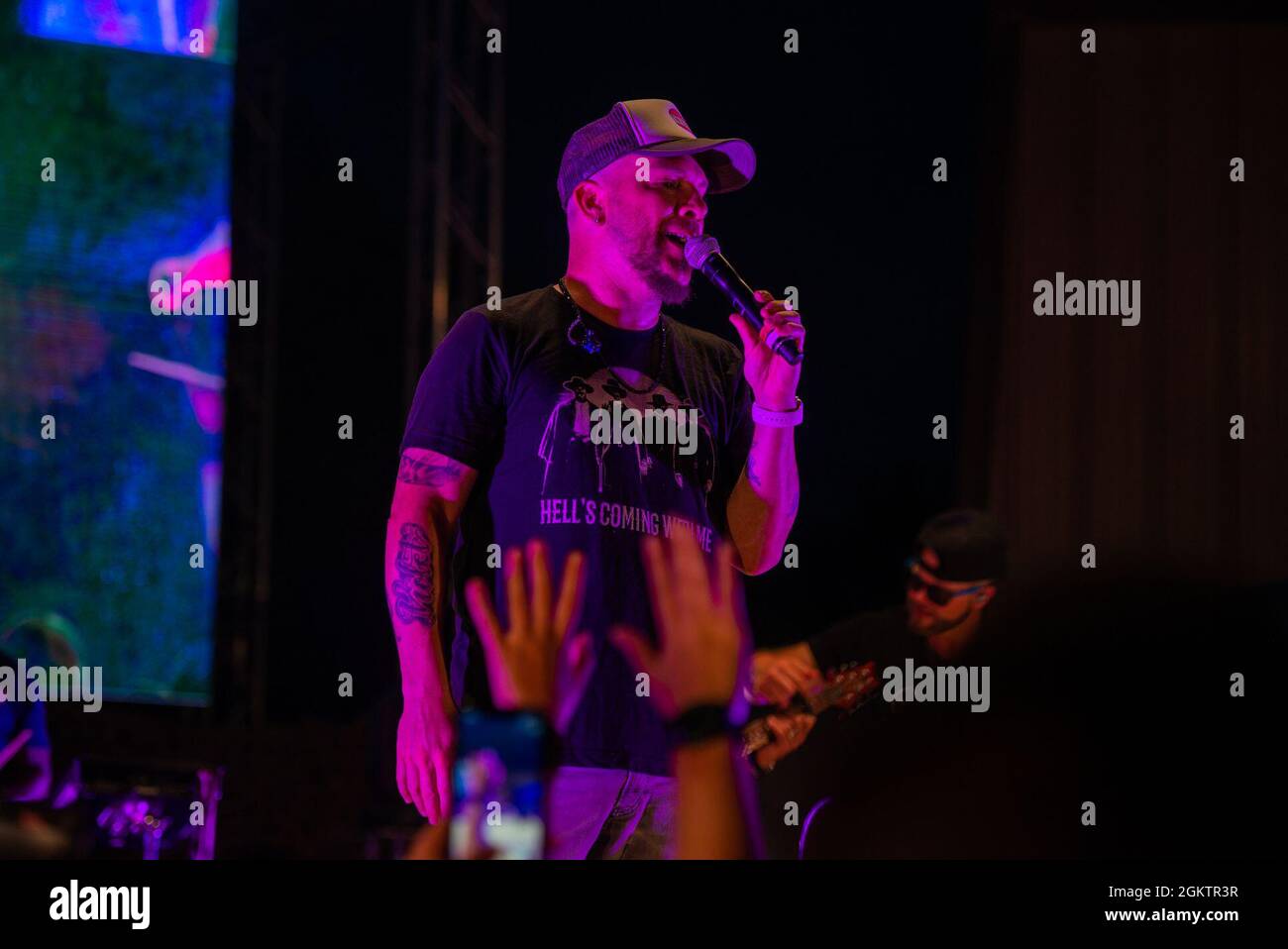 Chris Lucas, vocalist with the band LoCash, performs during the USO ...