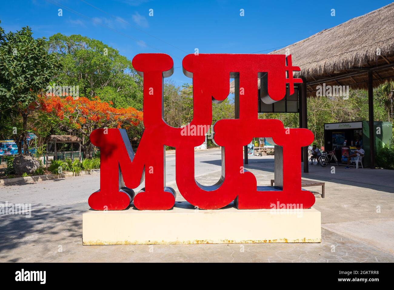 Multi colored Tulum text sign in the city on a bright sunny day Stock ...