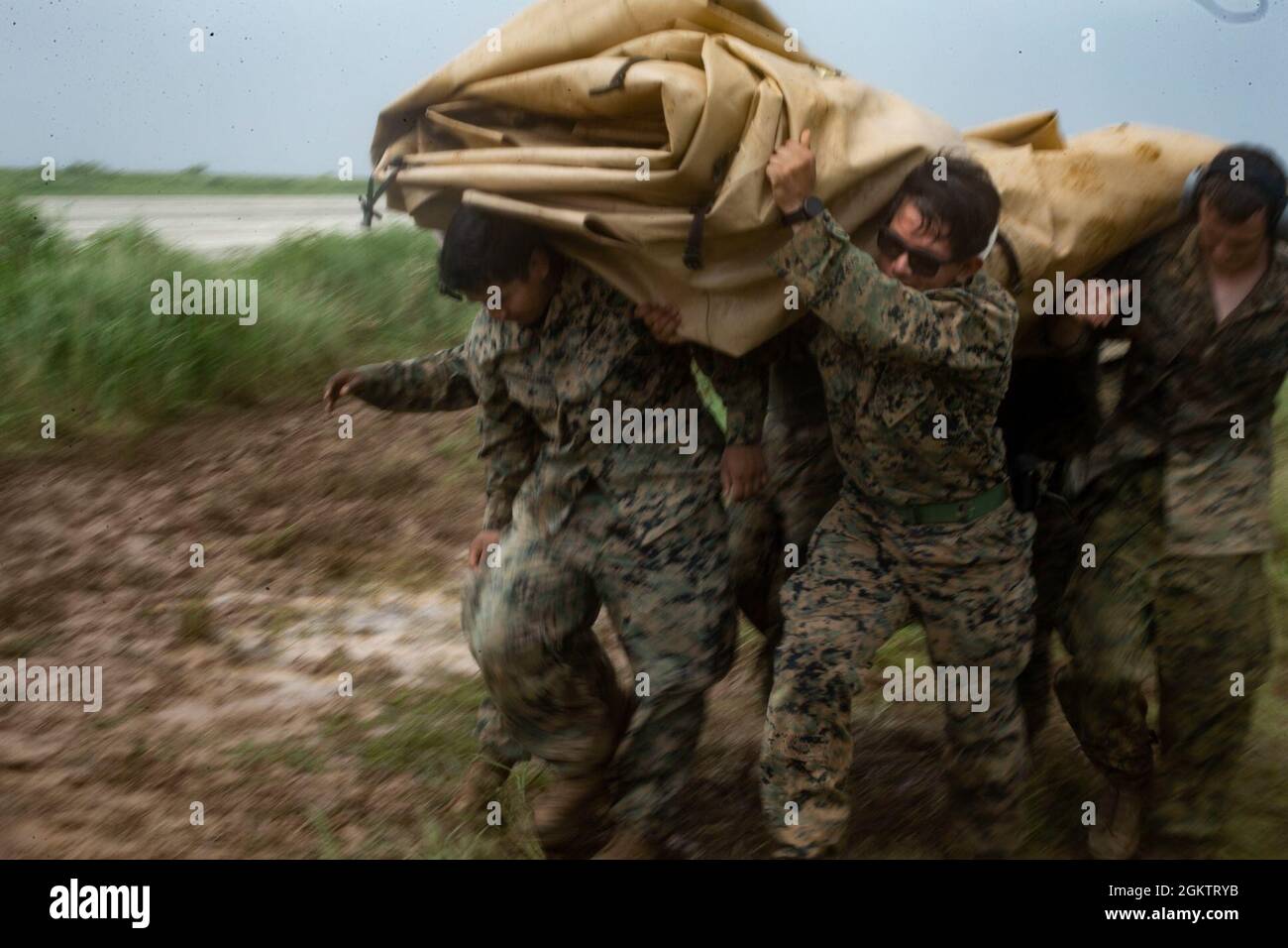U.S. Marines with 31st Marine Expeditionary Unit (MEU), load equipment ...