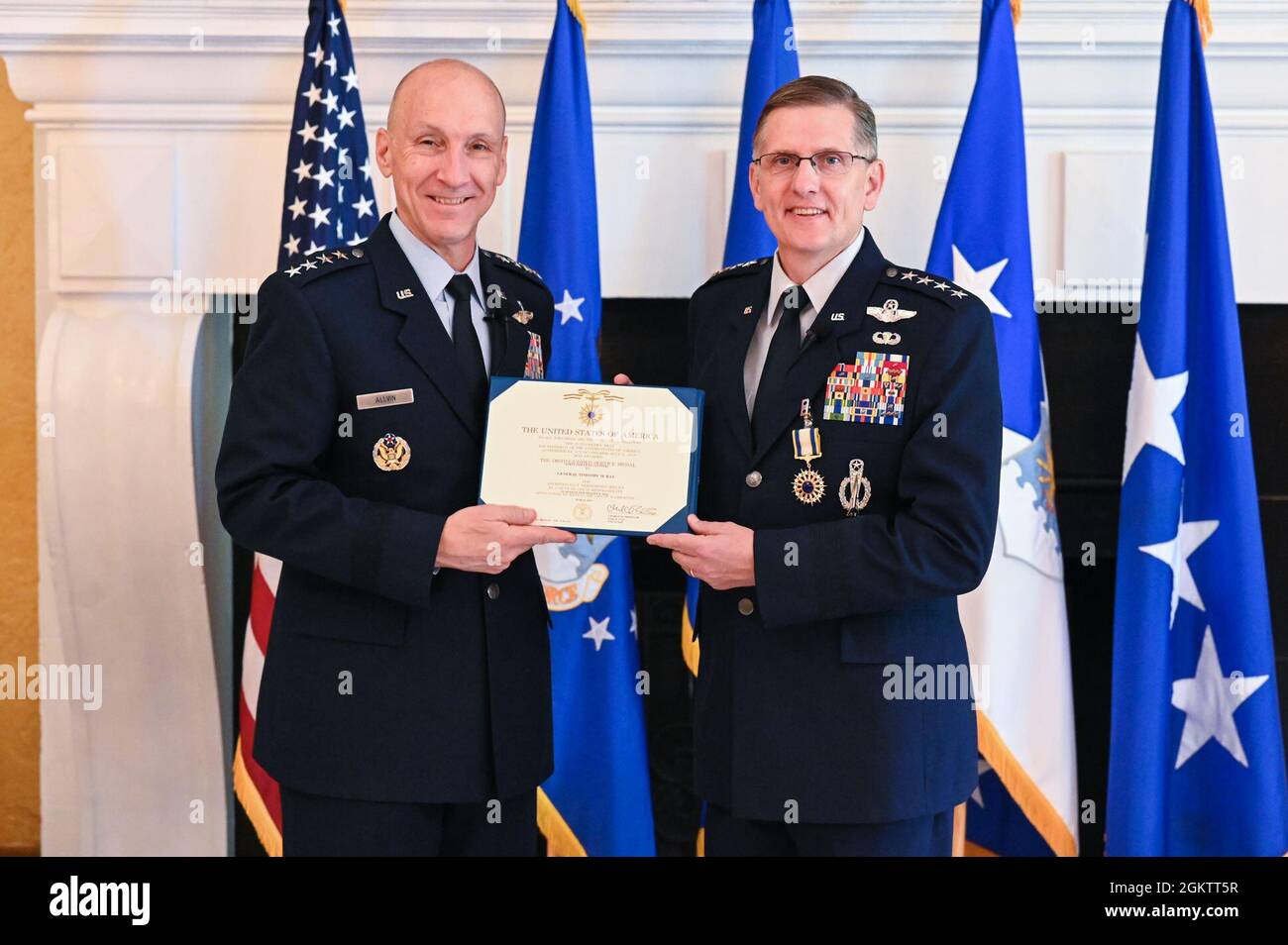 During the retirement ceremony of Gen. Tim Ray, right, commander of Air ...