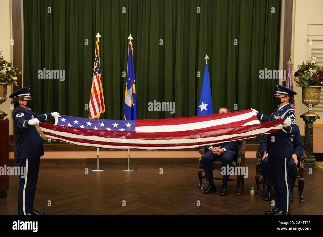 Joint Base San Antonio Honor Guard conduct a flag folding ceremony for ...