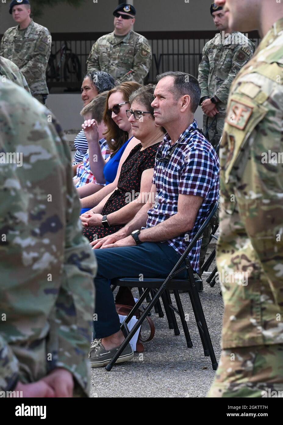 Members of Team Kirtland watch a change of command ceremony for the ...