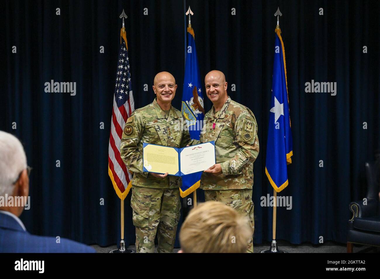 U.S. Air Force Col. Sloan Hollis (right), outgoing Department of the ...
