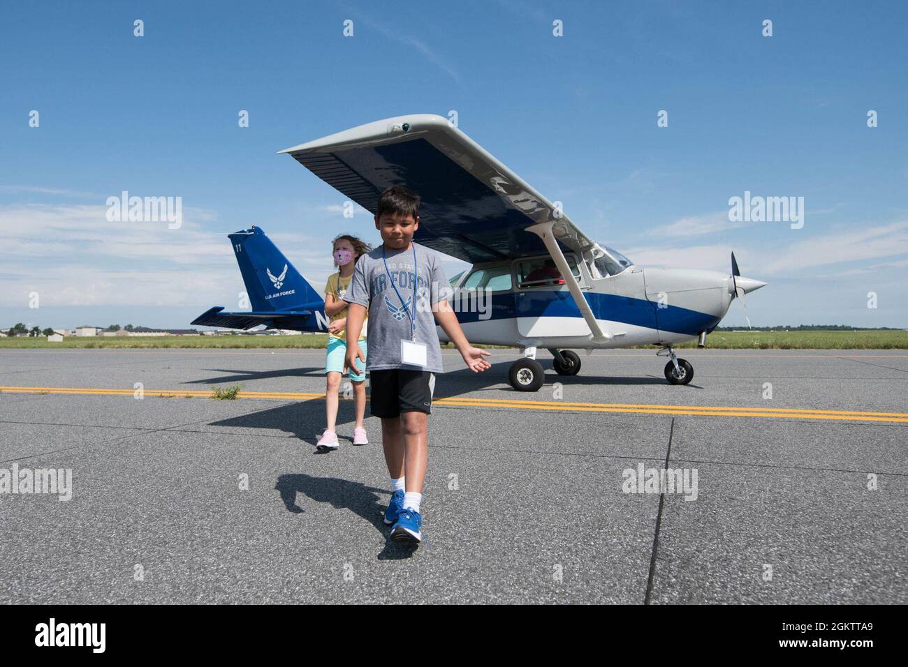 Ty Frazier and Noelle Robinson leave the runway after their flight in a ...