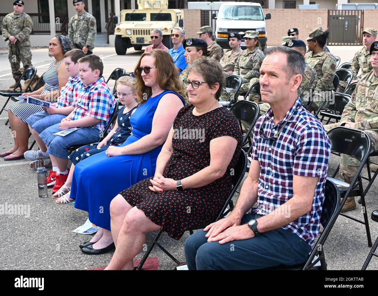 Members of Team Kirtland watch a change of command ceremony for the ...