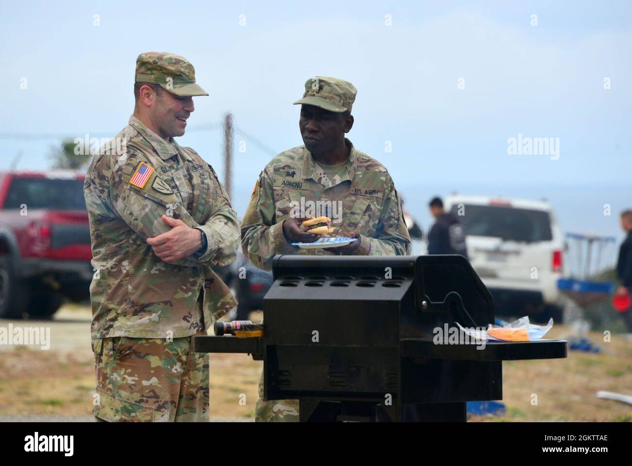 Chaplain (Capt.) Yaw Agbenu, right, and Maj. Steve Gluck talk as they ...