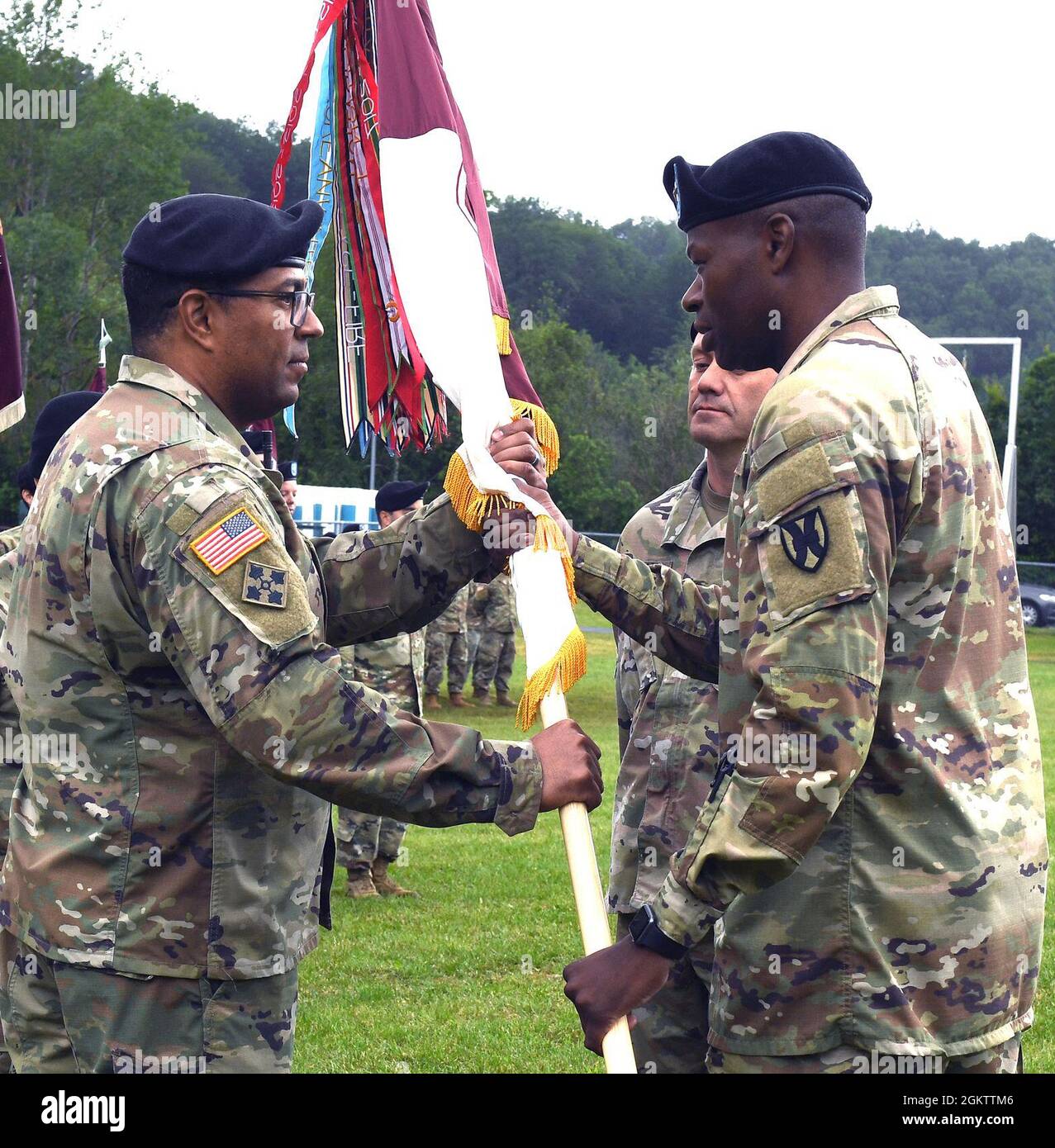 U.S. Army Brig. Gen. James M. Smith, commander, 21st Theater Sustainment Command (right), passes ...