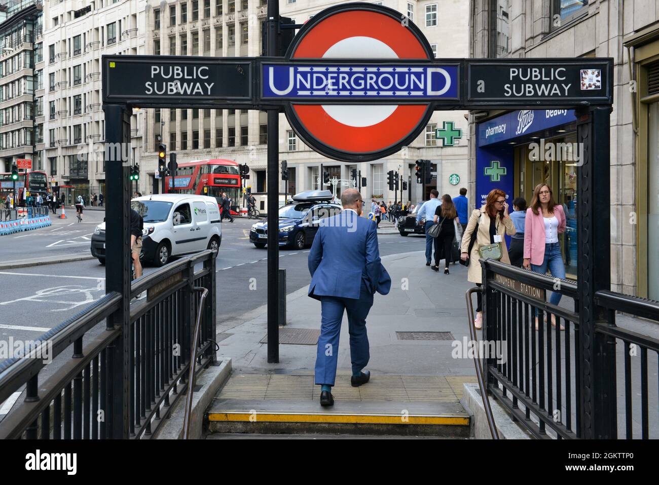 Commuter at the entrance to Monument underground Station Stock Photo ...