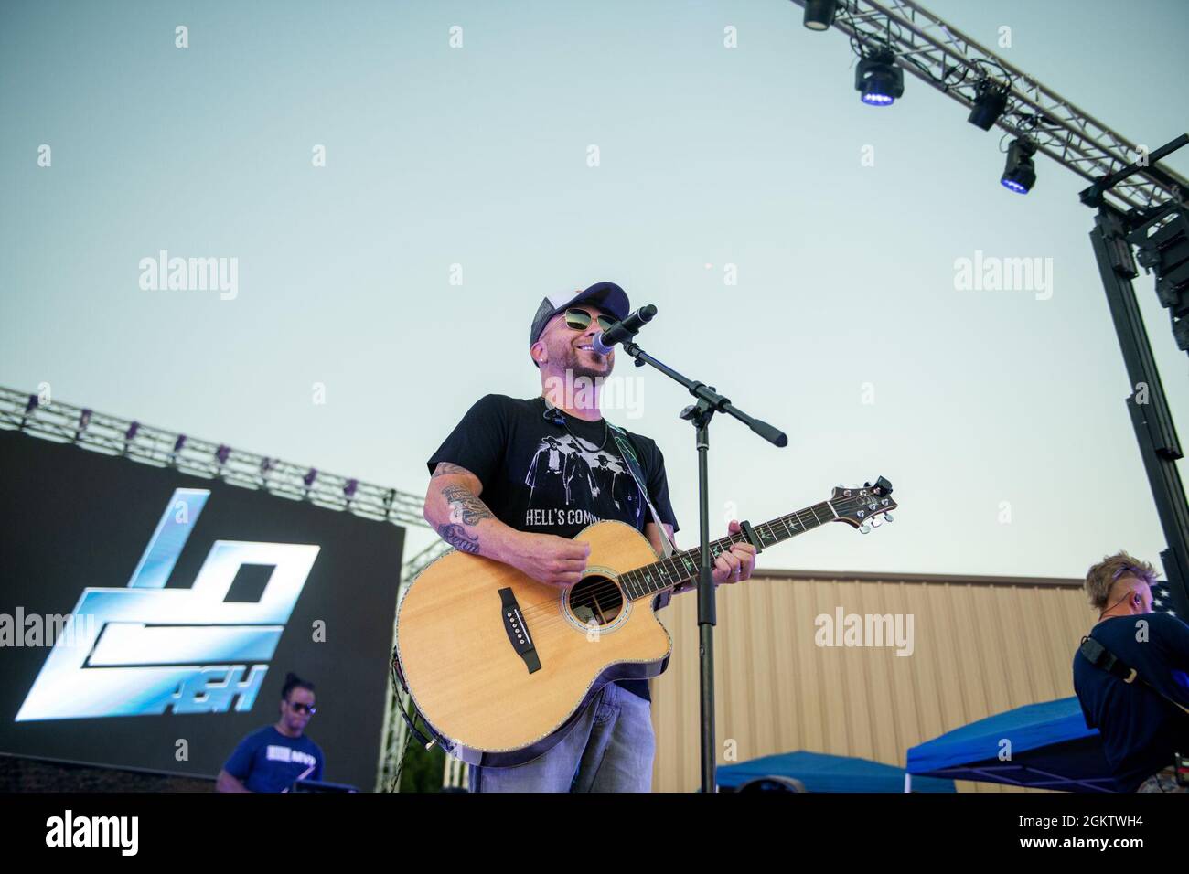 Chris Lucas, vocalist with the band LoCash, performs during the USO ...