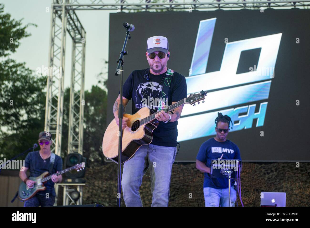 Chris Lucas (left), vocalist with the band LoCash, performs during the ...
