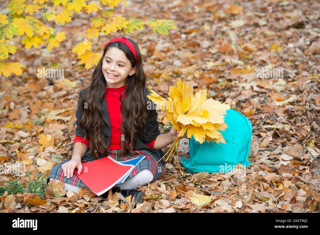 autumn nature. childhood happiness. back to school. kid with workbook ...