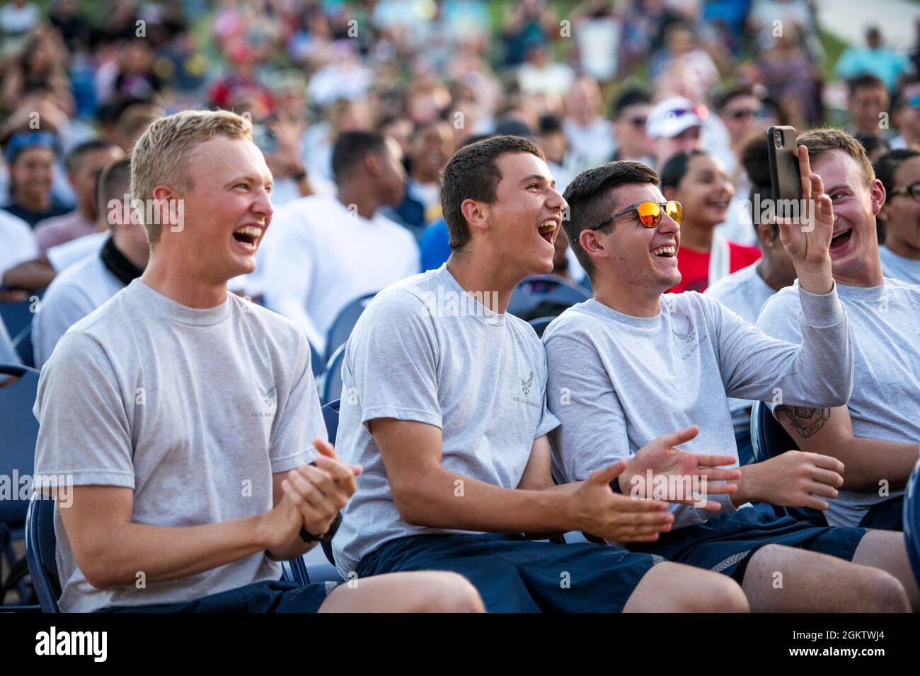 The audience watches as Taylor Williamson, comedian, performs during ...