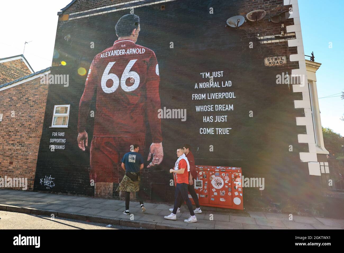 The sun shines over Liverpool fans as they admire the Trent Alexander ...