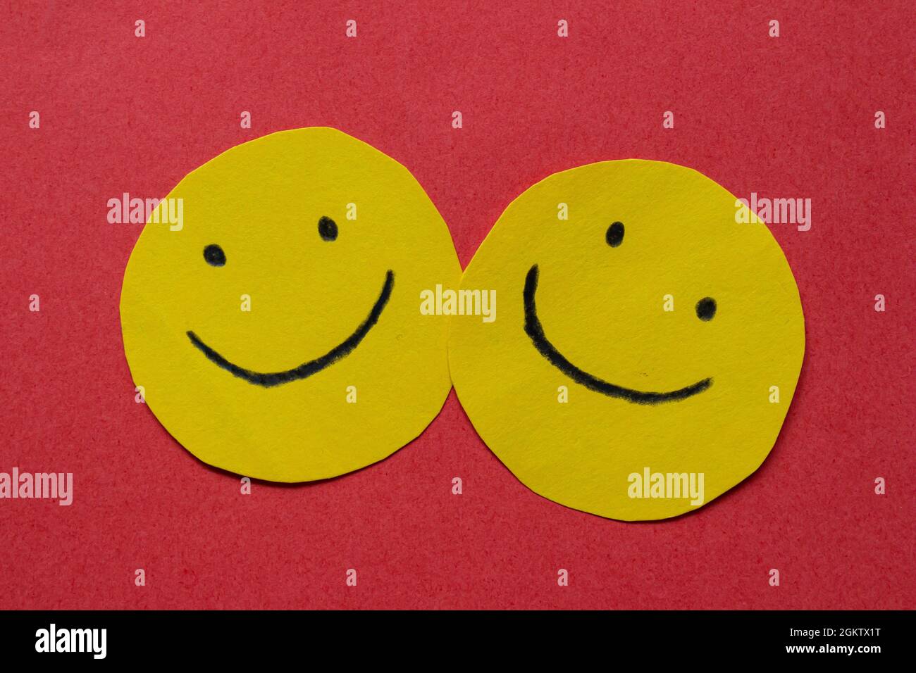 Happy faces emoticon drawn on sticker. Happiness, love and friendship ...