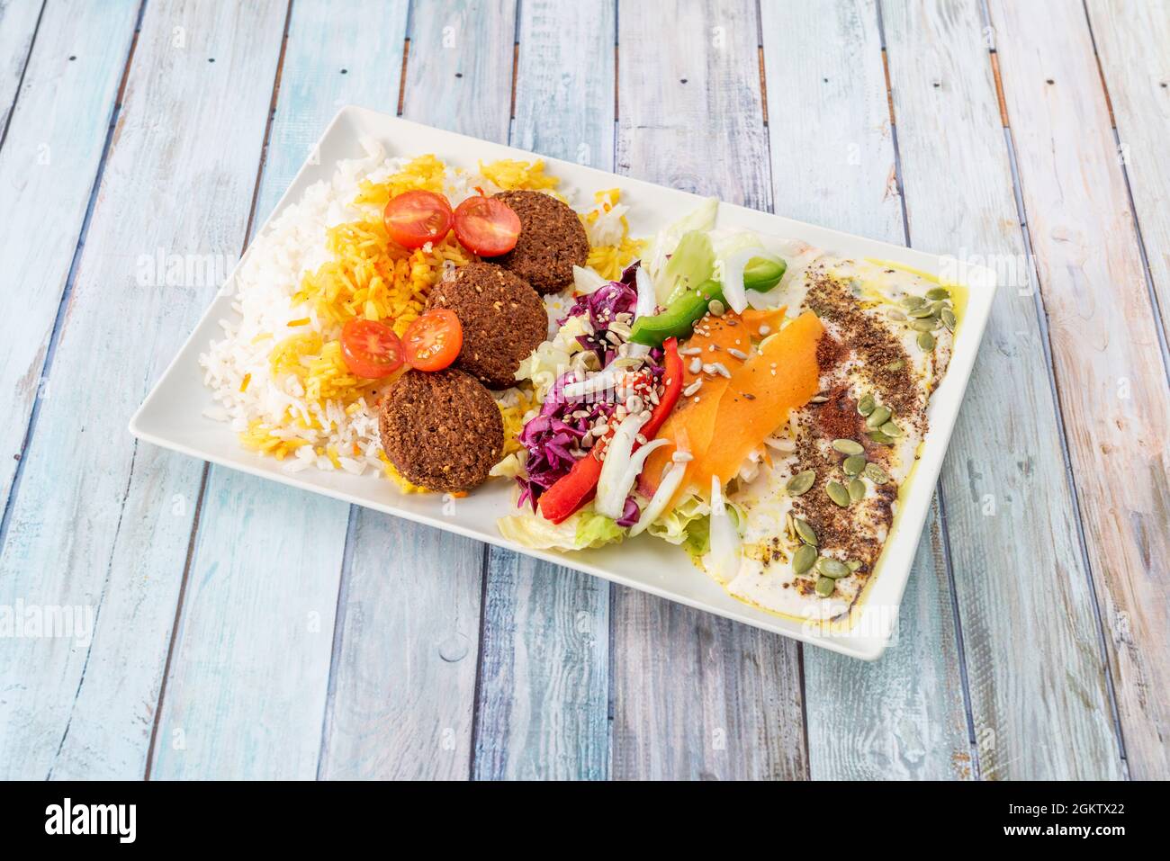 Falafel plate menu with yogurt, cherry tomatoes, white rice and basmati ...