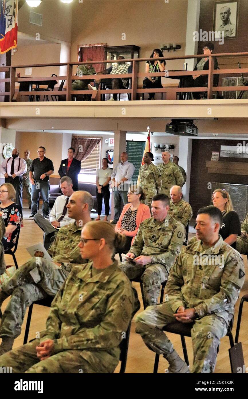 Audience members watch as Command Sgt. Maj. Raquel DiDomenico becomes the new Fort McCoy ...