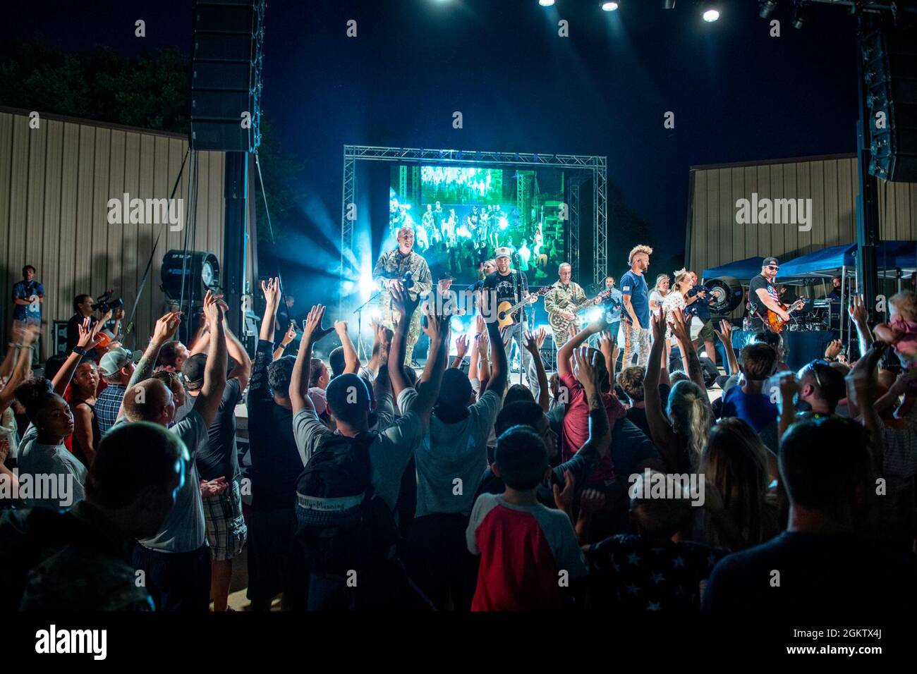 Entertainers participate with the closing performance during the USO ...