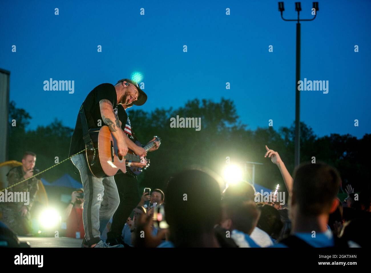 Chris Lucas, vocalist with the band LoCash, performs during the USO ...