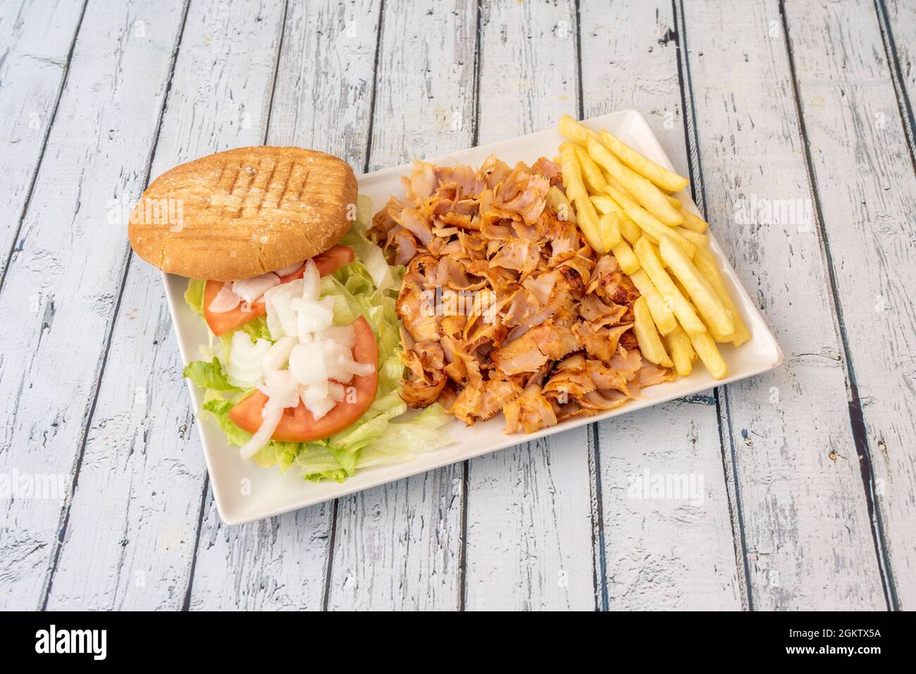 Kebab menu tray complete with chopped roast chicken, side of French ...