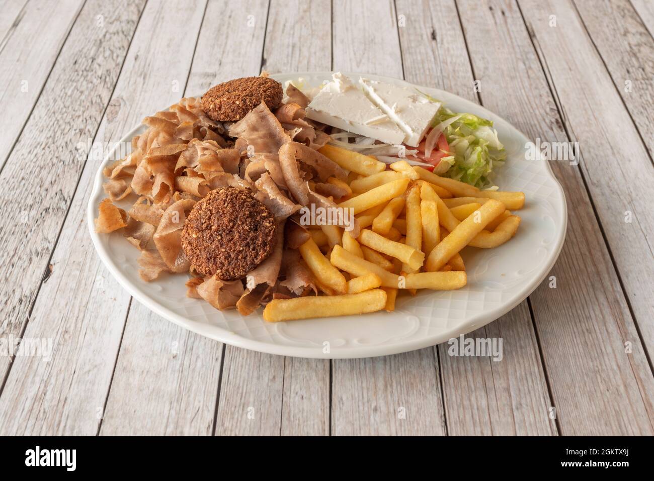 Kebab menu with falafel and sour cheese, with a portion of French fries ...