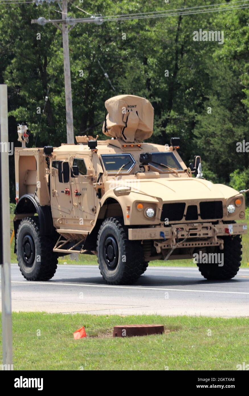 Personnel drive a Joint Light Tactical Vehicle (JLTV) through the ...