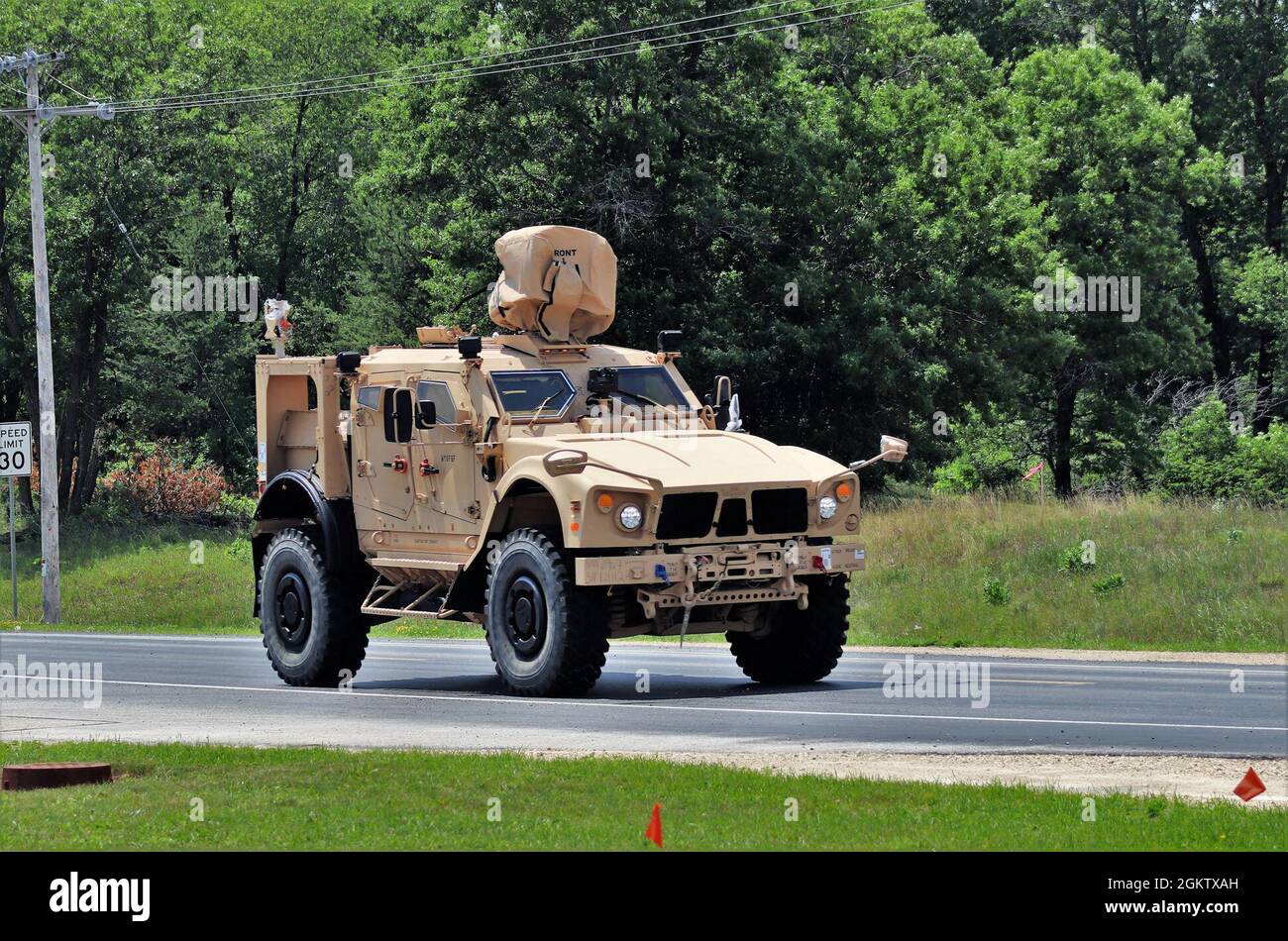 Personnel drive a Joint Light Tactical Vehicle (JLTV) through the ...