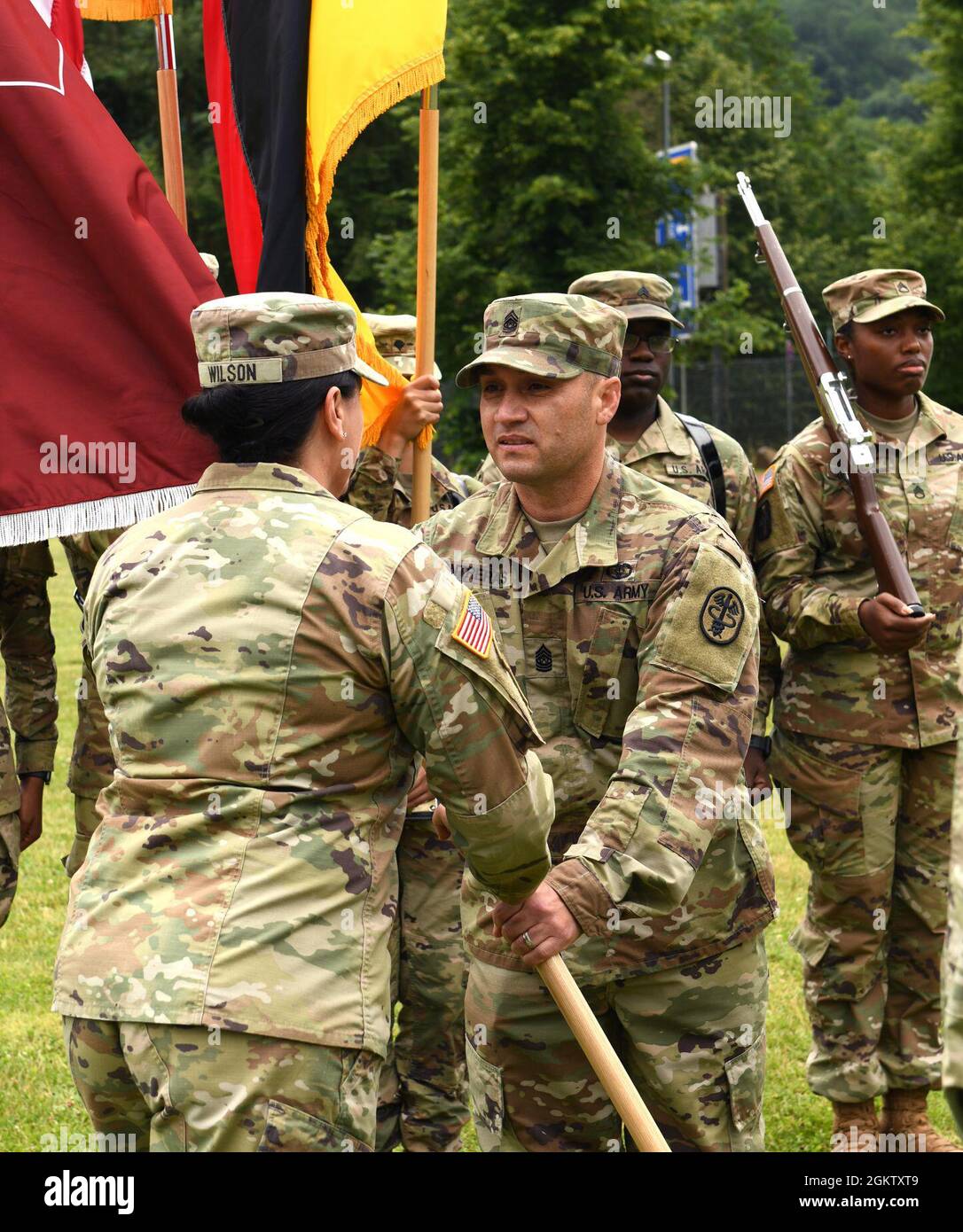 U.S. Army Lt. Col. Casey Wilson (left) commander, passes the unit ...