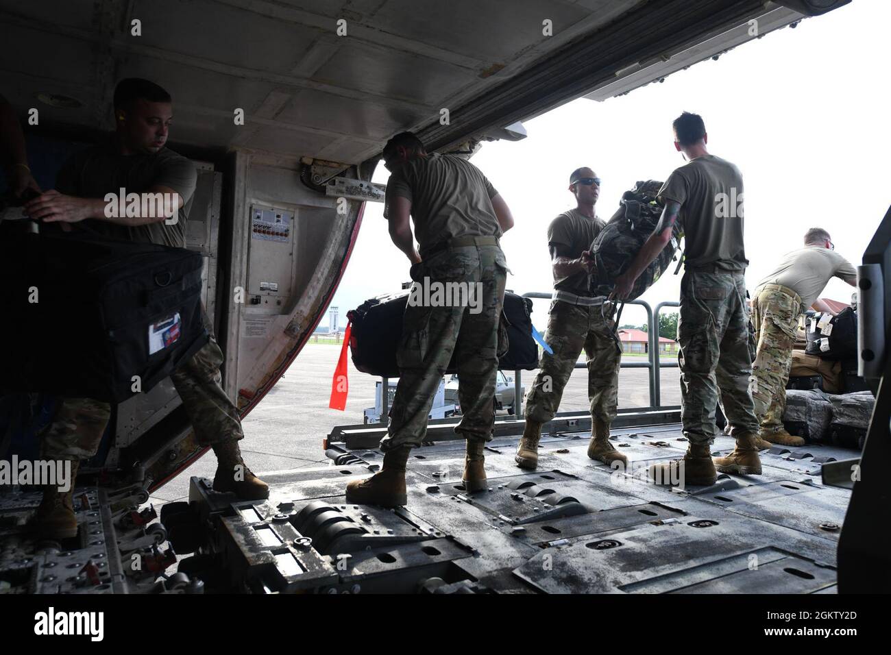 Airman work together to load cargo at Maxwell Air Force Base, Alabama ...