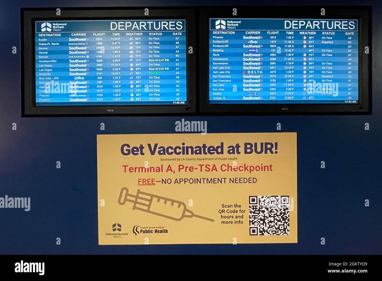 A free COVID-19 vaccination sign sponsored by the LA County Department ...