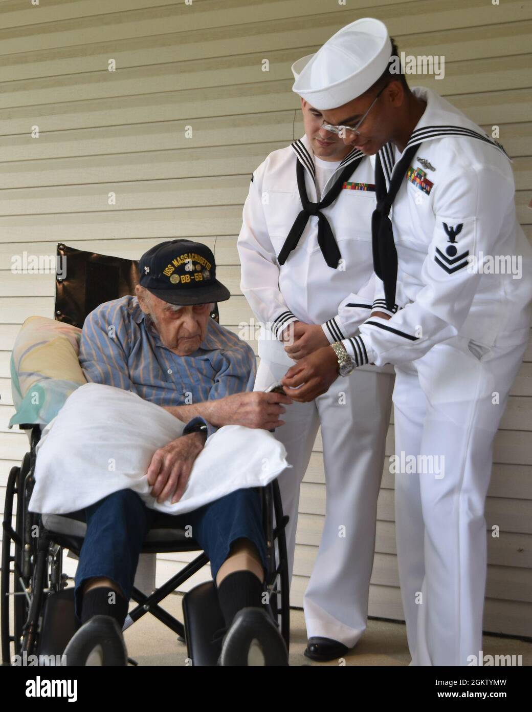 EMN2 Donovan Jordan of PCU Massachusetts (SN 798) presents a command ...