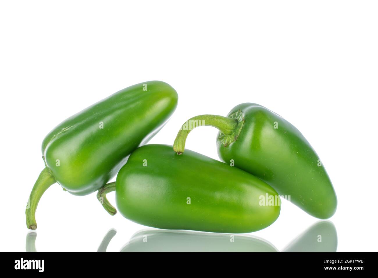 Three green spicy pepper pods, close-up, isolated on white Stock Photo ...