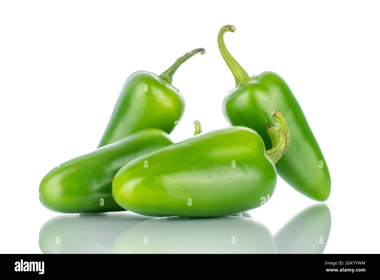 Four green spicy pepper pods, close-up, isolated on white Stock Photo ...