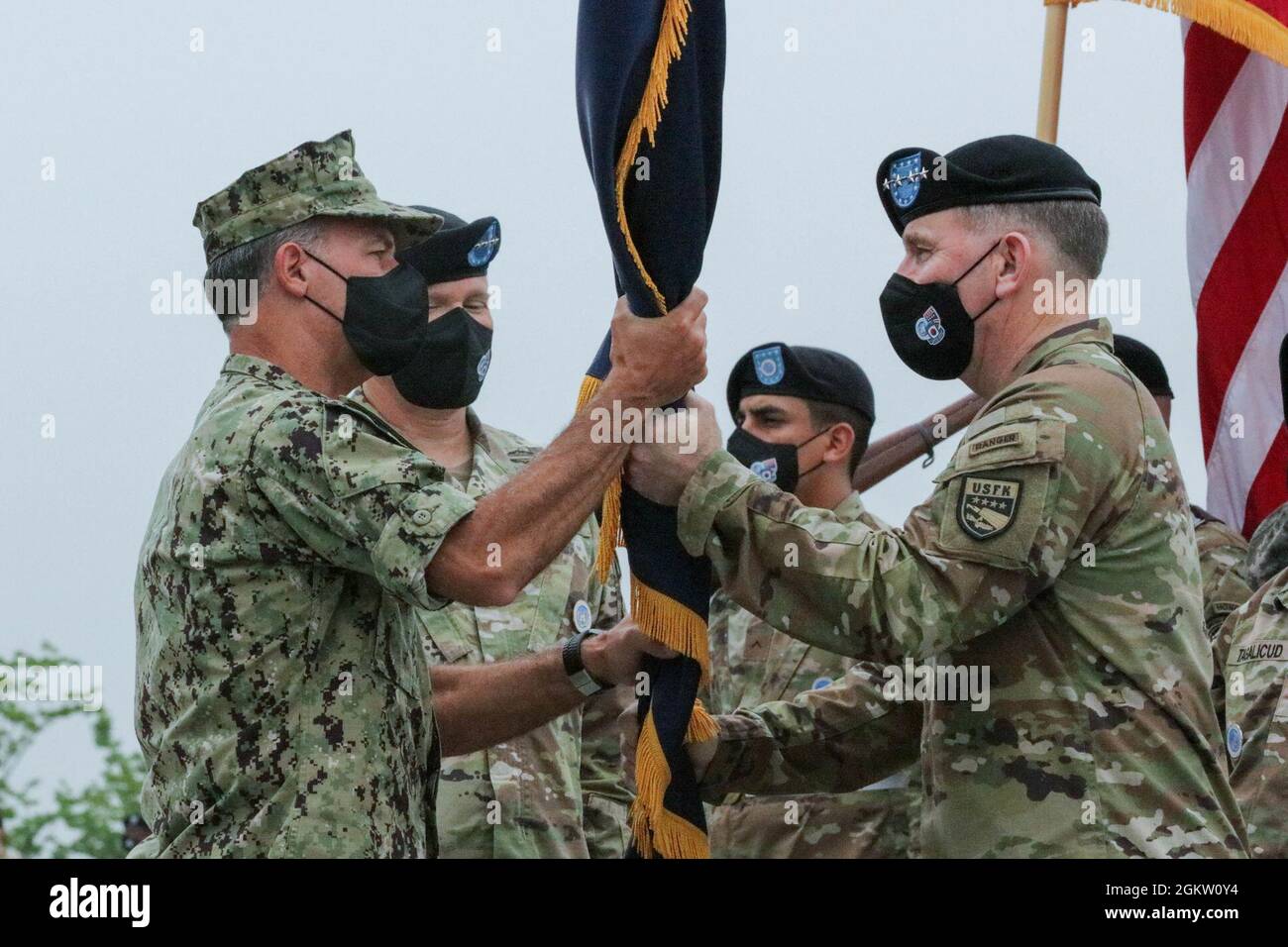 General Robert B. "Abe" Abrams passes the colors to Adm. John C ...