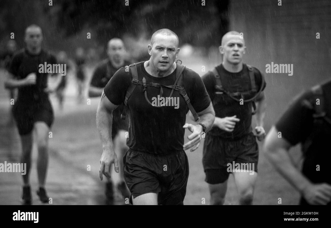 U.S. Marine Corps officer candidates with Alpha Company run through the ...