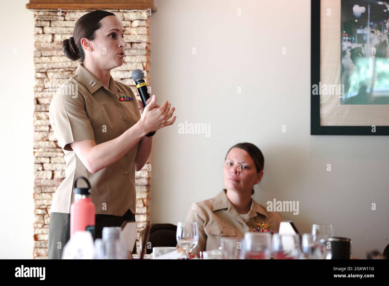U.S. Marine Corps Capt. Rachel Baker, left, company commander of Motor ...