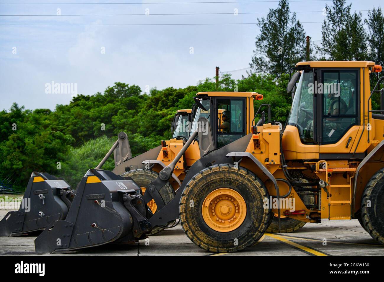 U.S. Air Force Airmen from the 18th Civil Engineer Squadron use front ...