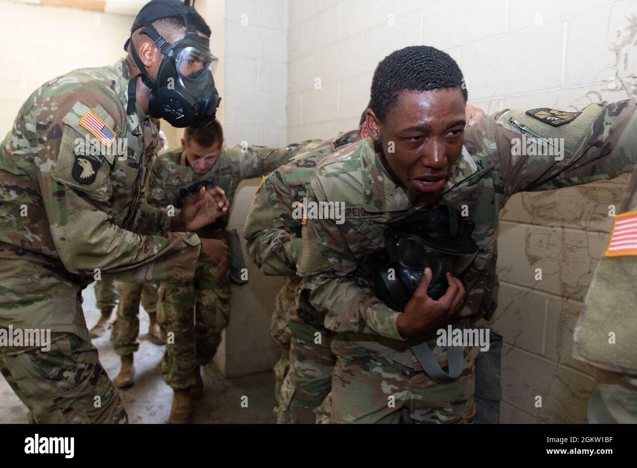 Cadets from 6th Regiment, Advanced Camp, walk out of the gas chamber ...