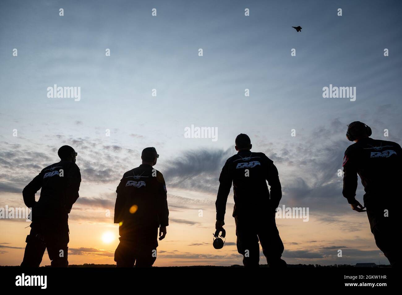 Members of the F-22 Demo Team watch Maj. Josh Gunderson, F-22 Demo Team ...