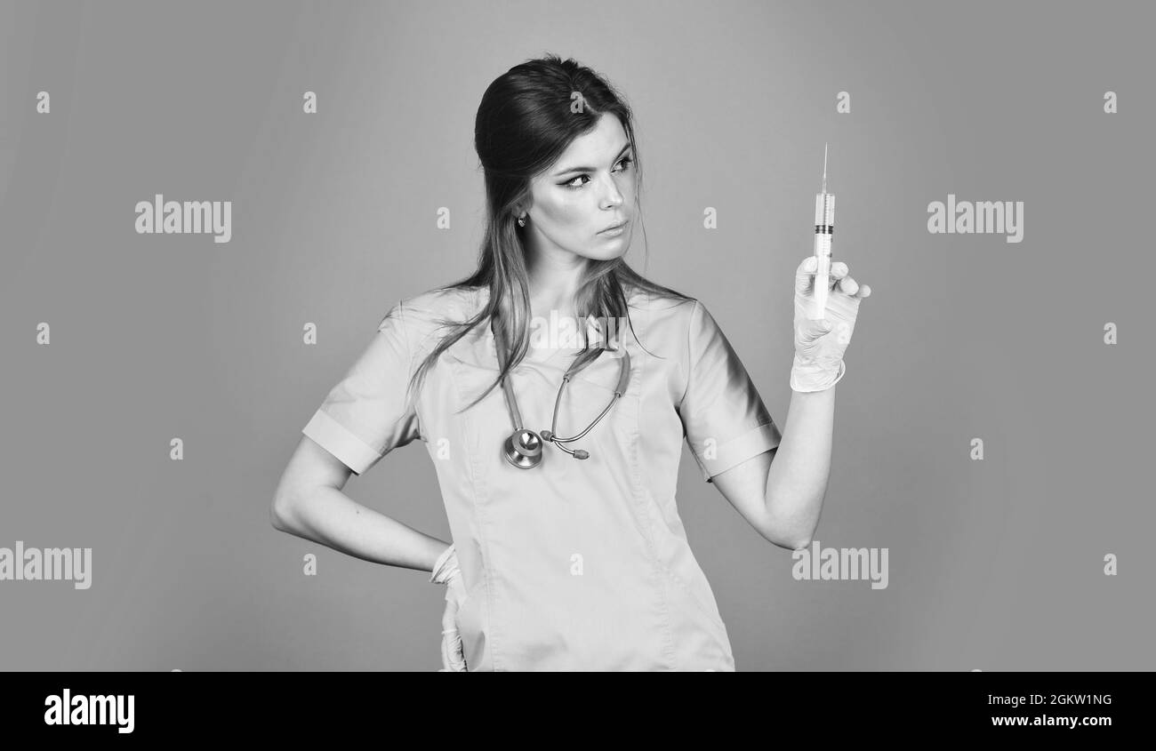 Innovation. Nurse with coronavirus vaccine in syringe. Medical ...