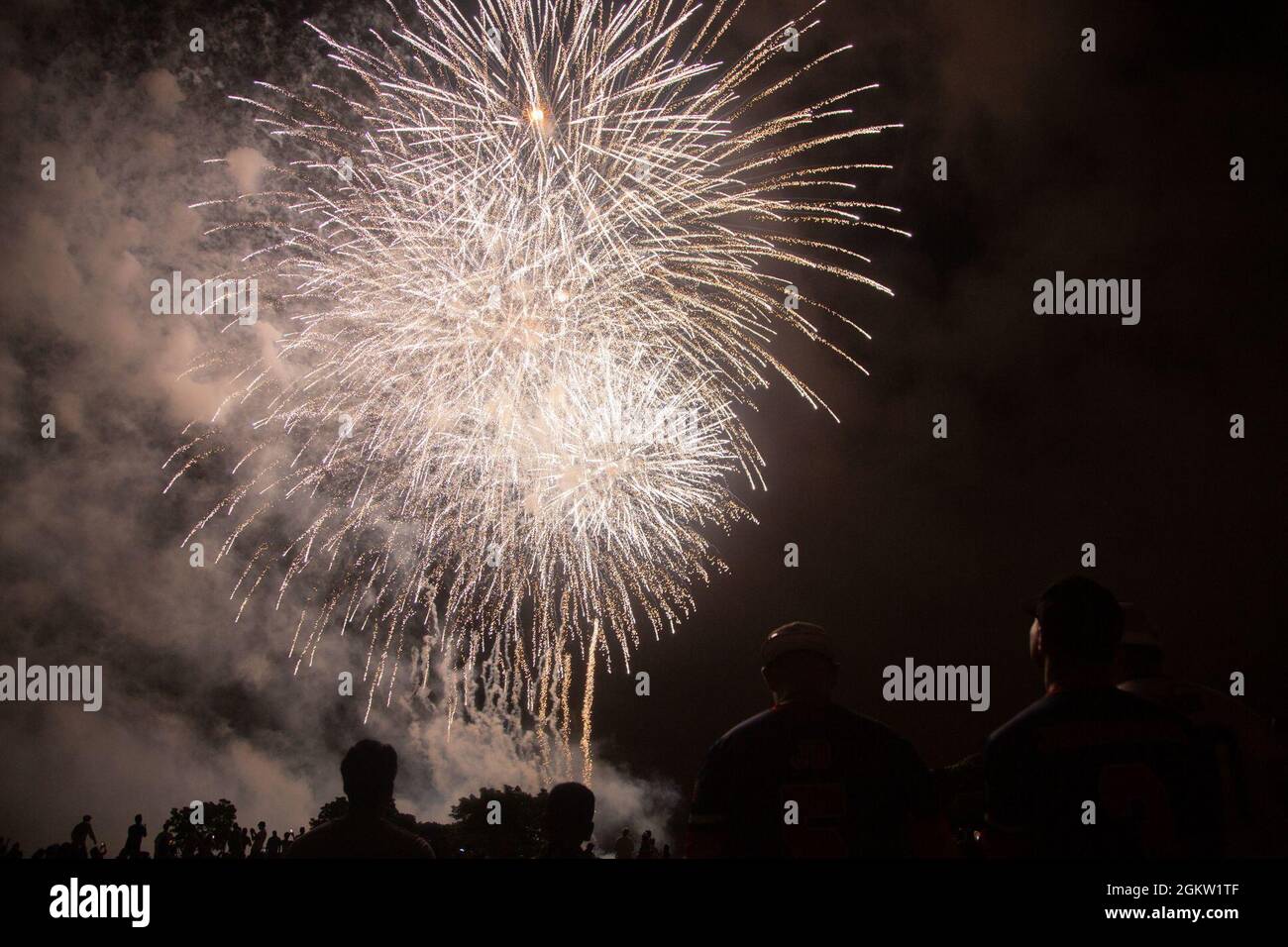U.S. service members and their families watch the Fourth of July ...