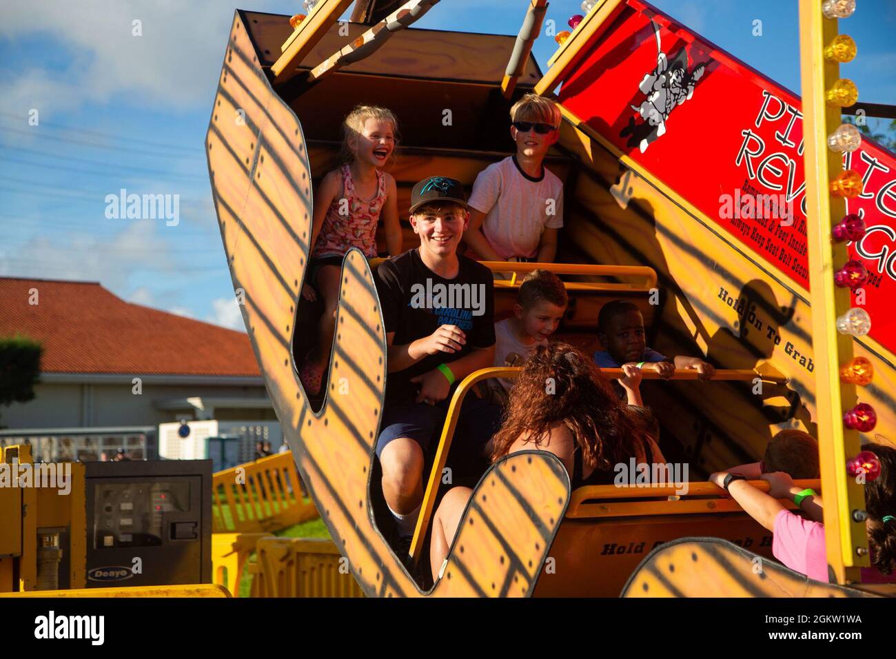 Children of all ages go on one of the rides during the Camp Foster ...