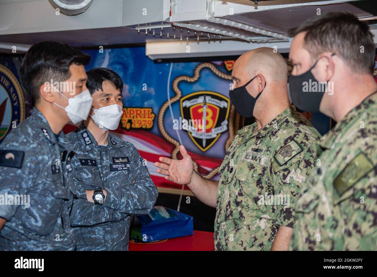 210703-N-HG846-1319 SYDNEY (July 3, 2021) – Cmdr. J.J. Murawski (left ...