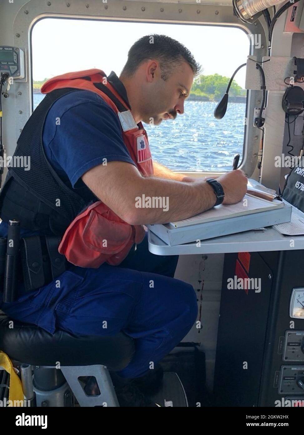 U.S. Coast Guard Petty Officer 2nd Class Cody Bartlett, a boatswain’s ...