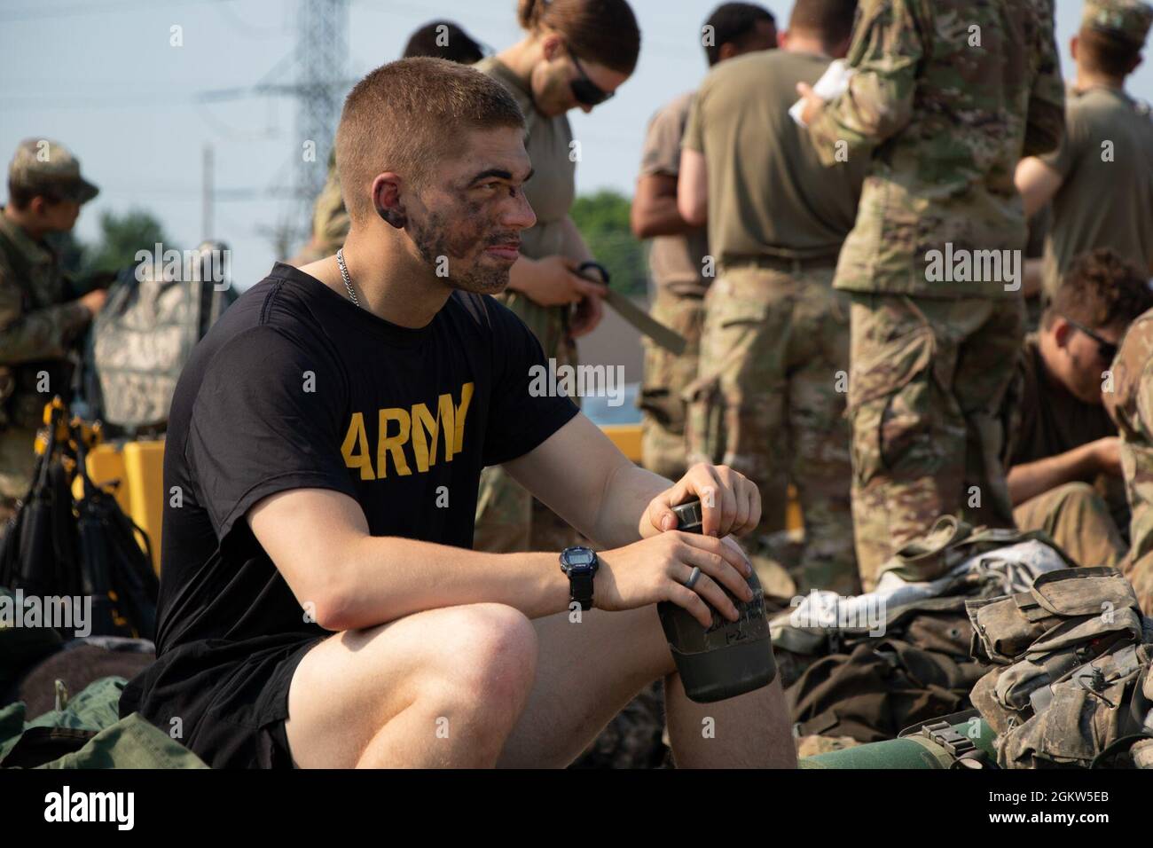 Cadet Steven Bullock, University of North Georgia, holds his canteen ...