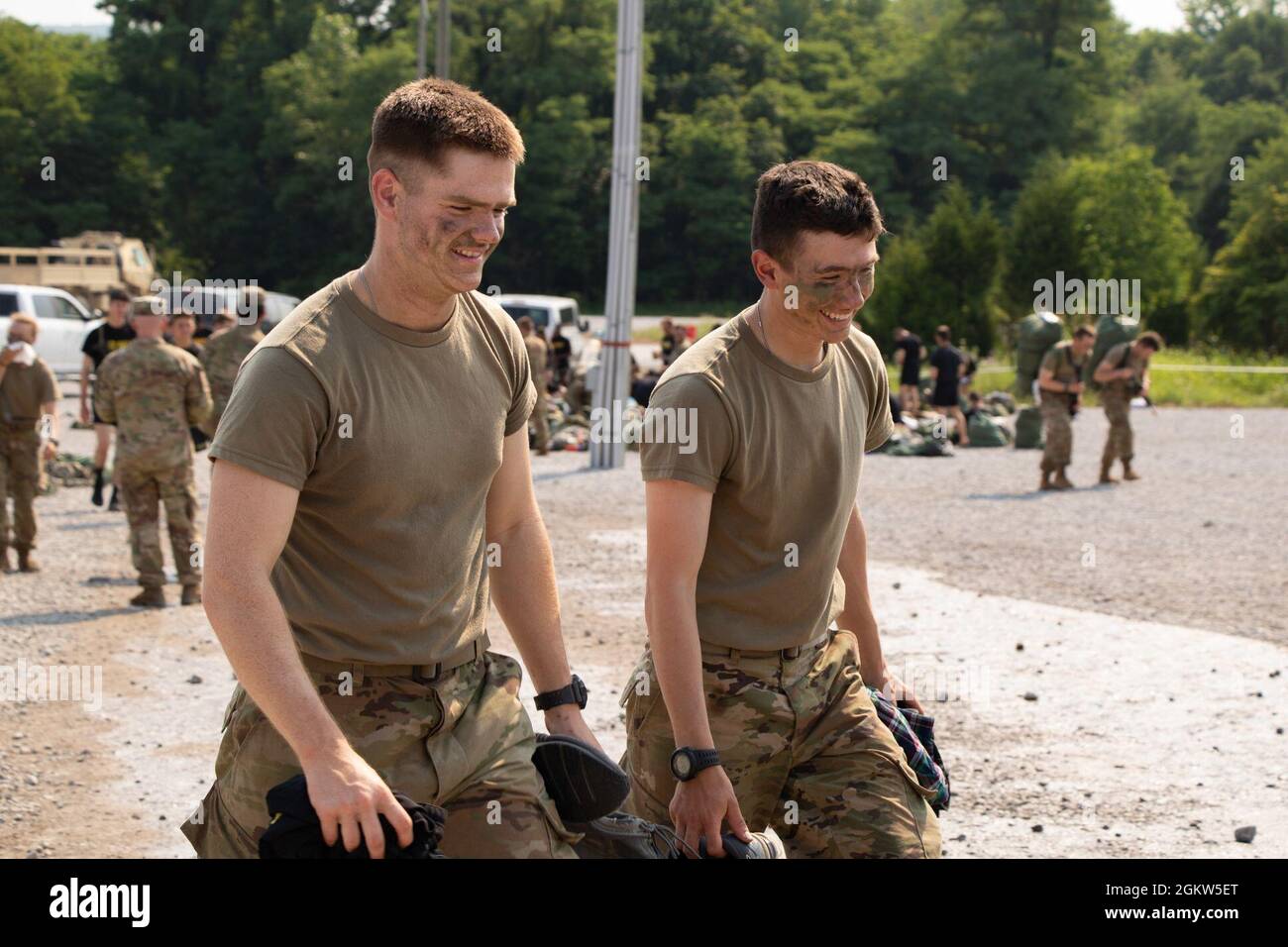 Cadets smile on their way to the shower trailer on refit day after ...