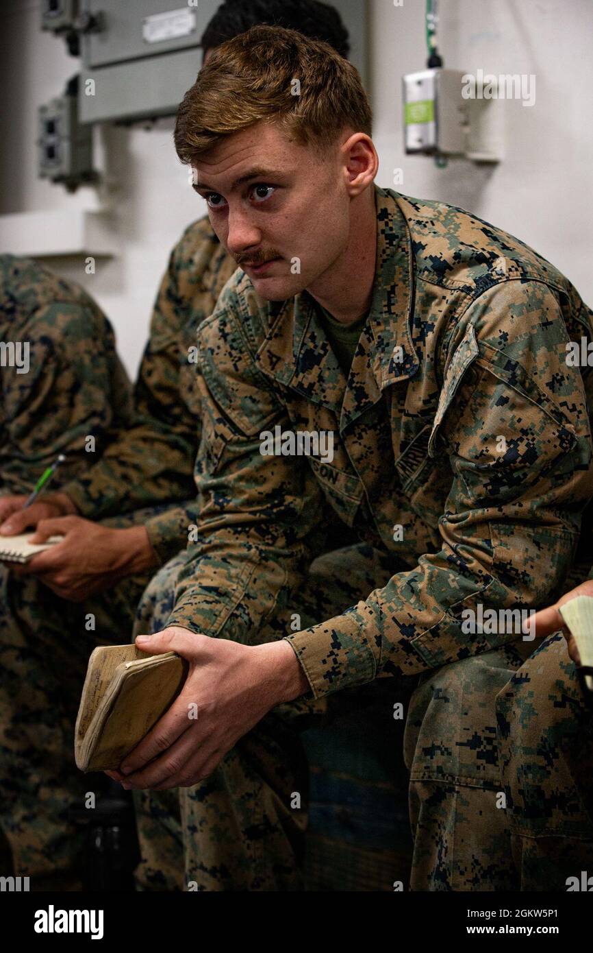 U.S. Marine Corps Lance Cpl. Kainen Johnson, a combat engineer attached ...